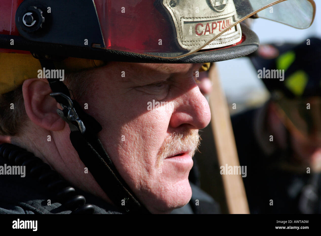A captain firefighter at a working emergency scene in command Stock ...