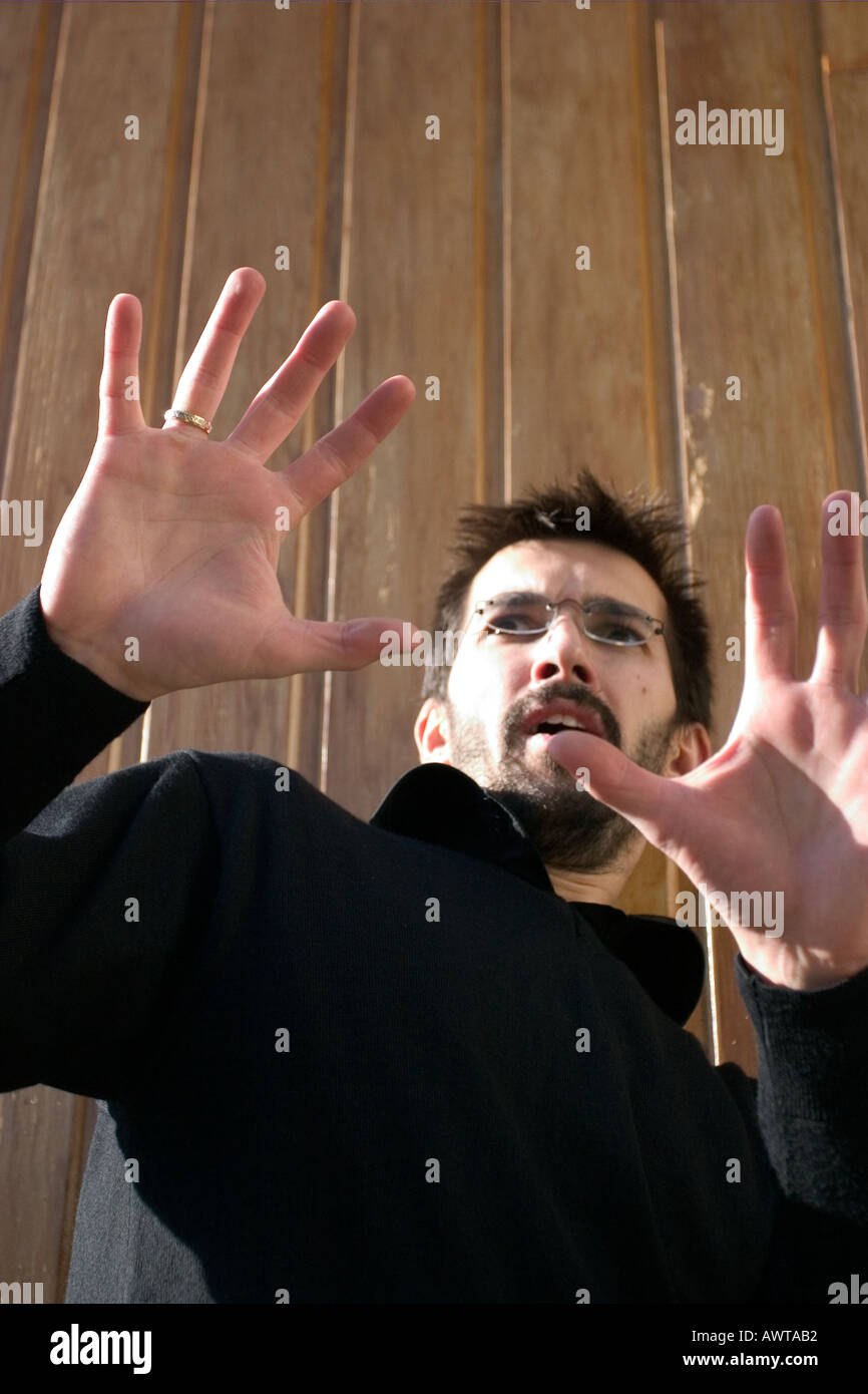 man stretching his arm hide face Stock Photo - Alamy