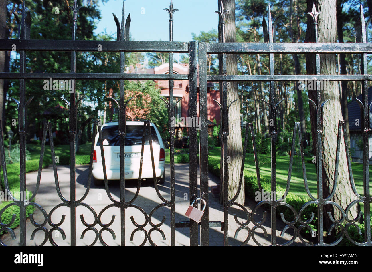 A house seen through a locked gate, Swetlogorsk, Russia Stock Photo - Alamy