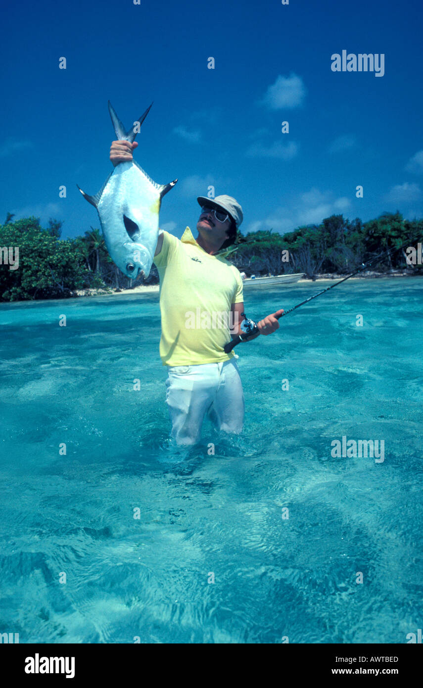 Belize salt water Fishing Man Holding Permit Stock Photo - Alamy