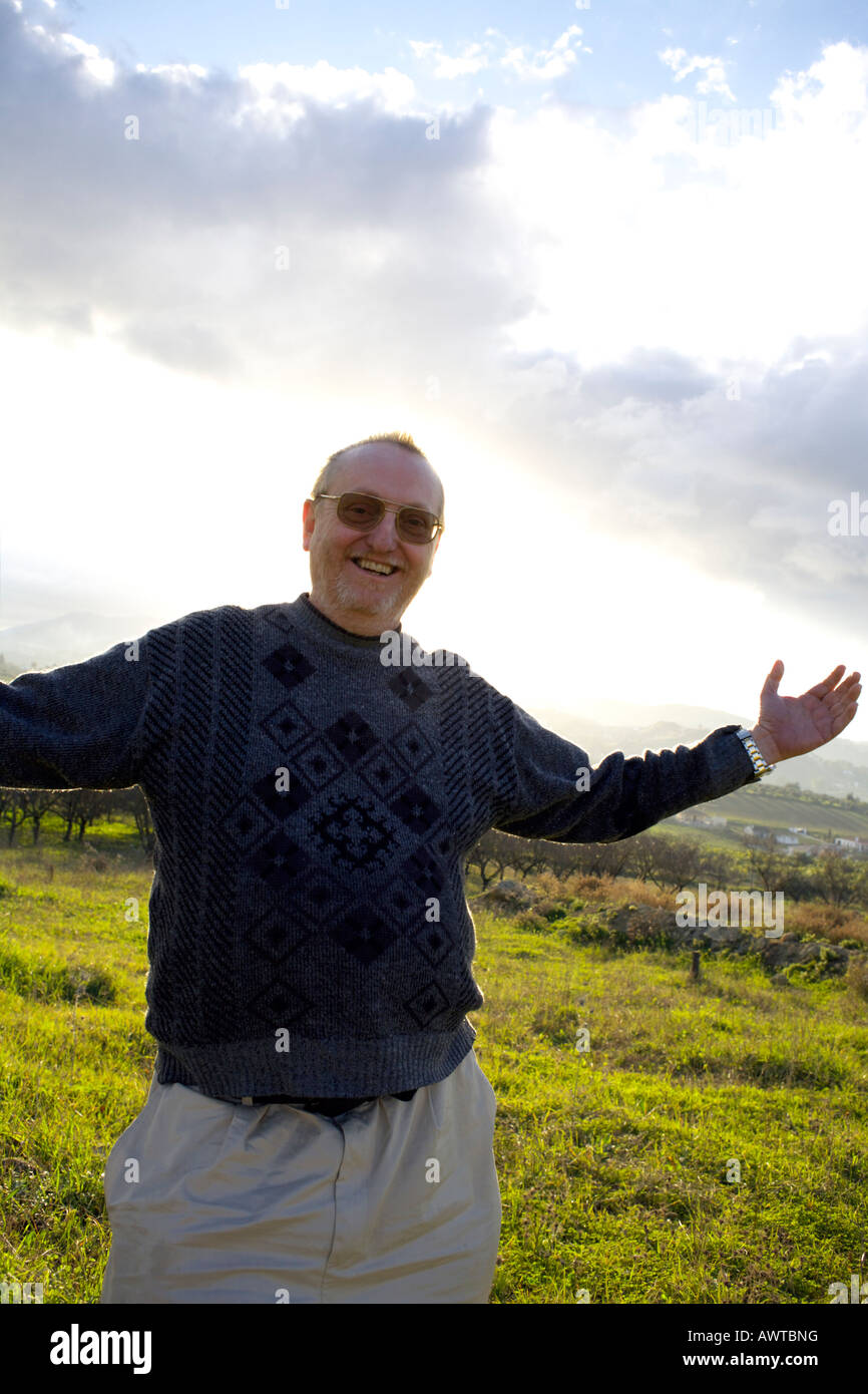 Very happy smiling man with arms outstretched Stock Photo - Alamy
