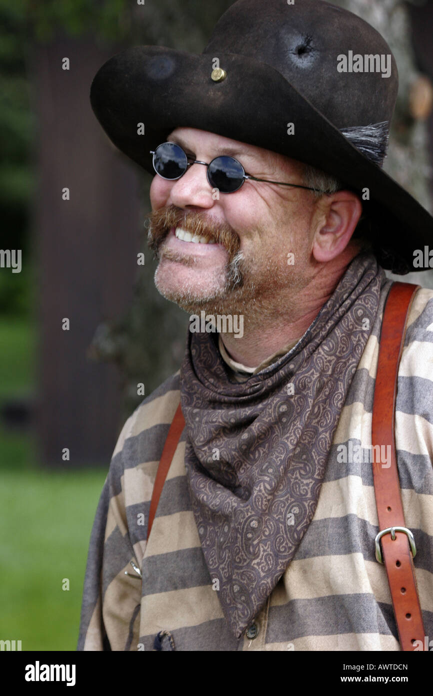 A cowboy standing with a smile on his face Stock Photo - Alamy