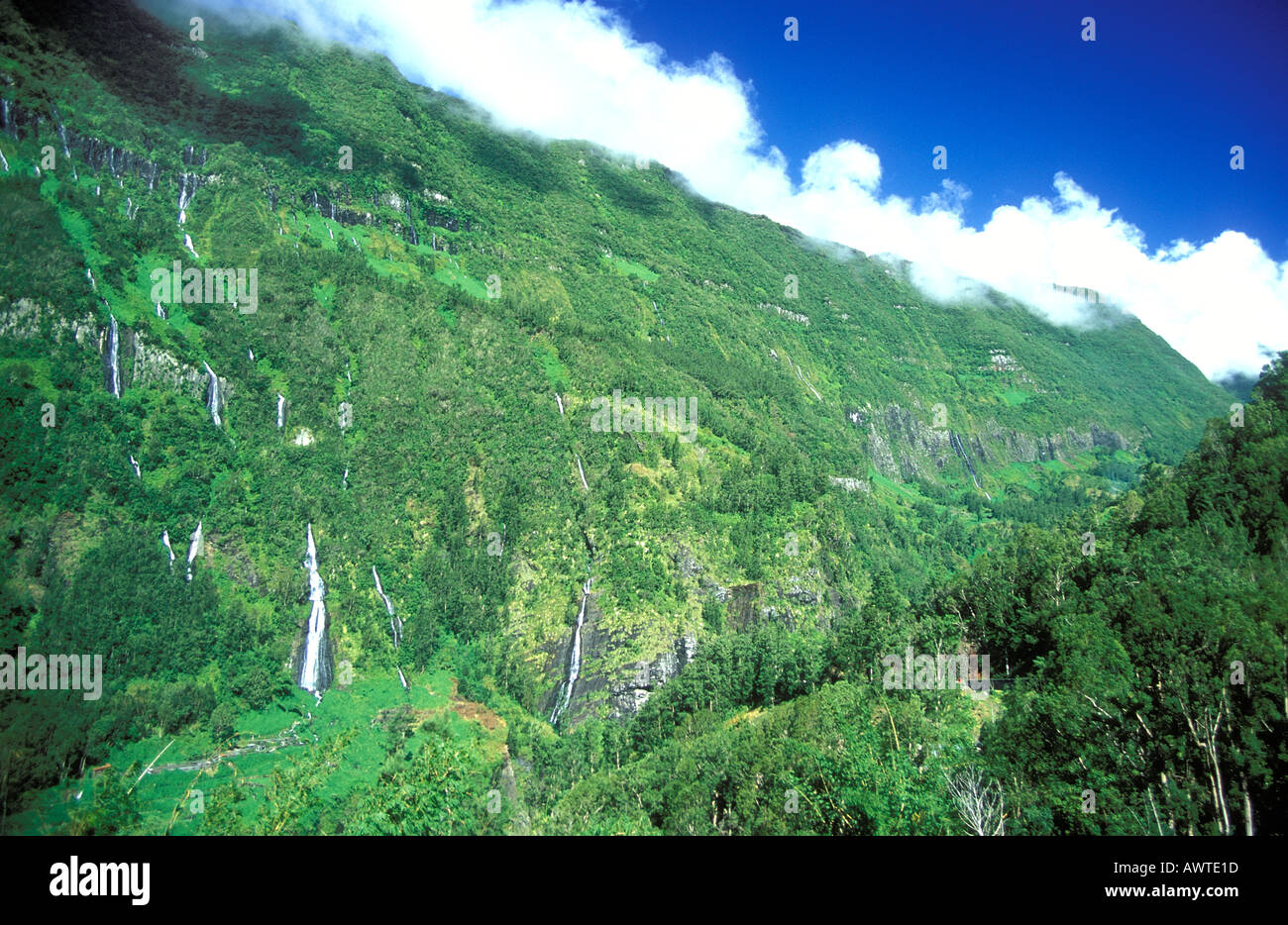 Waterfall falling down Mountain Side Stock Photo - Alamy