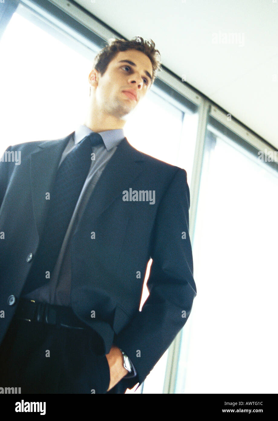 Businessman standing, view from below Stock Photo - Alamy