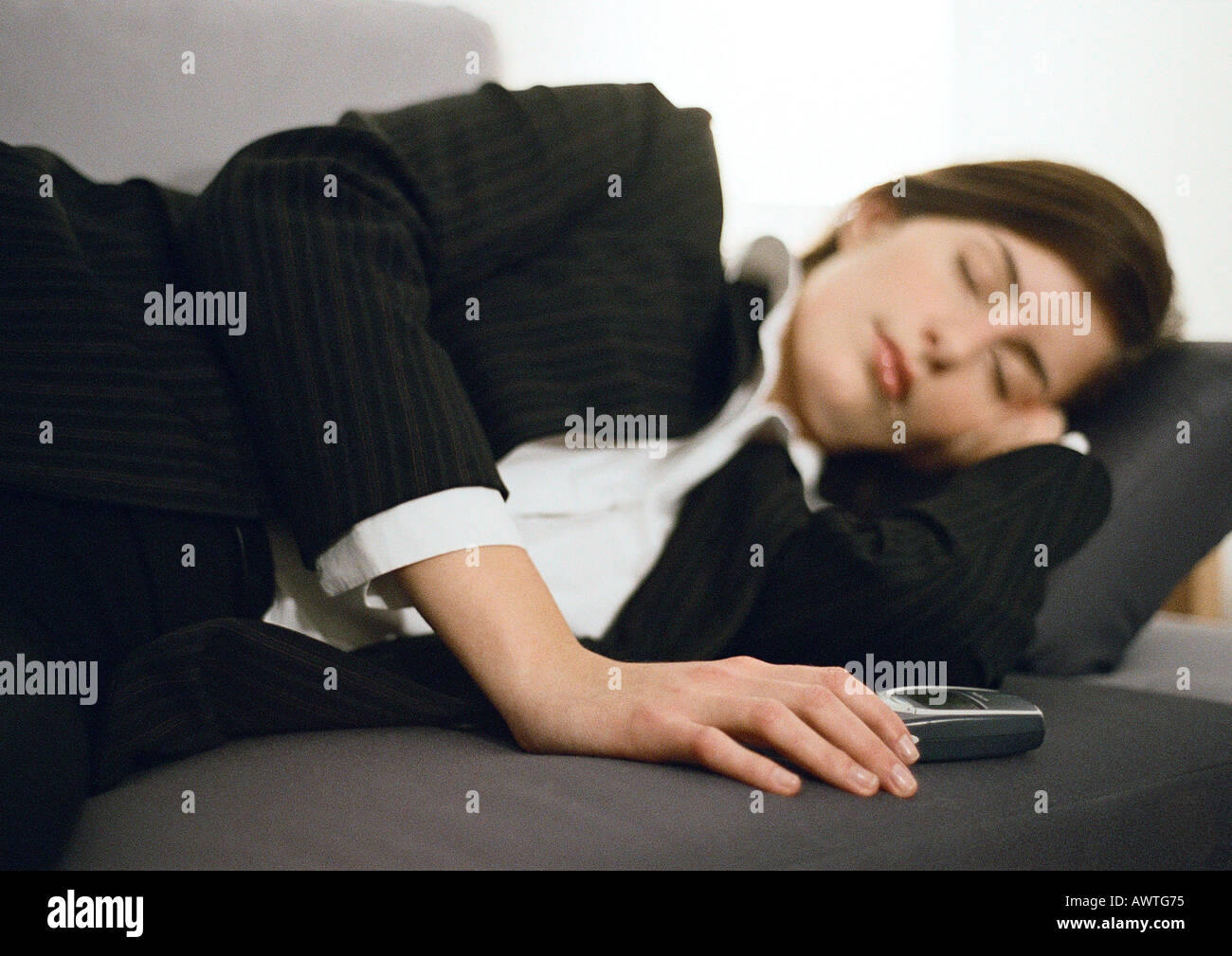 Businesswoman resting on sofa taking hi-res stock photography and ...