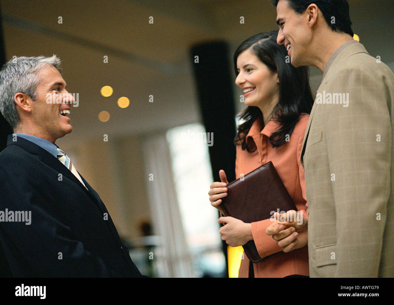 Group of business people laughing together Stock Photo - Alamy