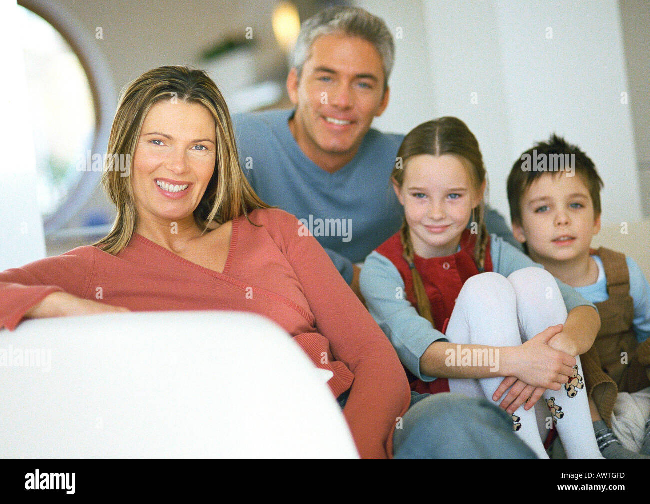 Family sitting together on couch, portrait Stock Photo - Alamy