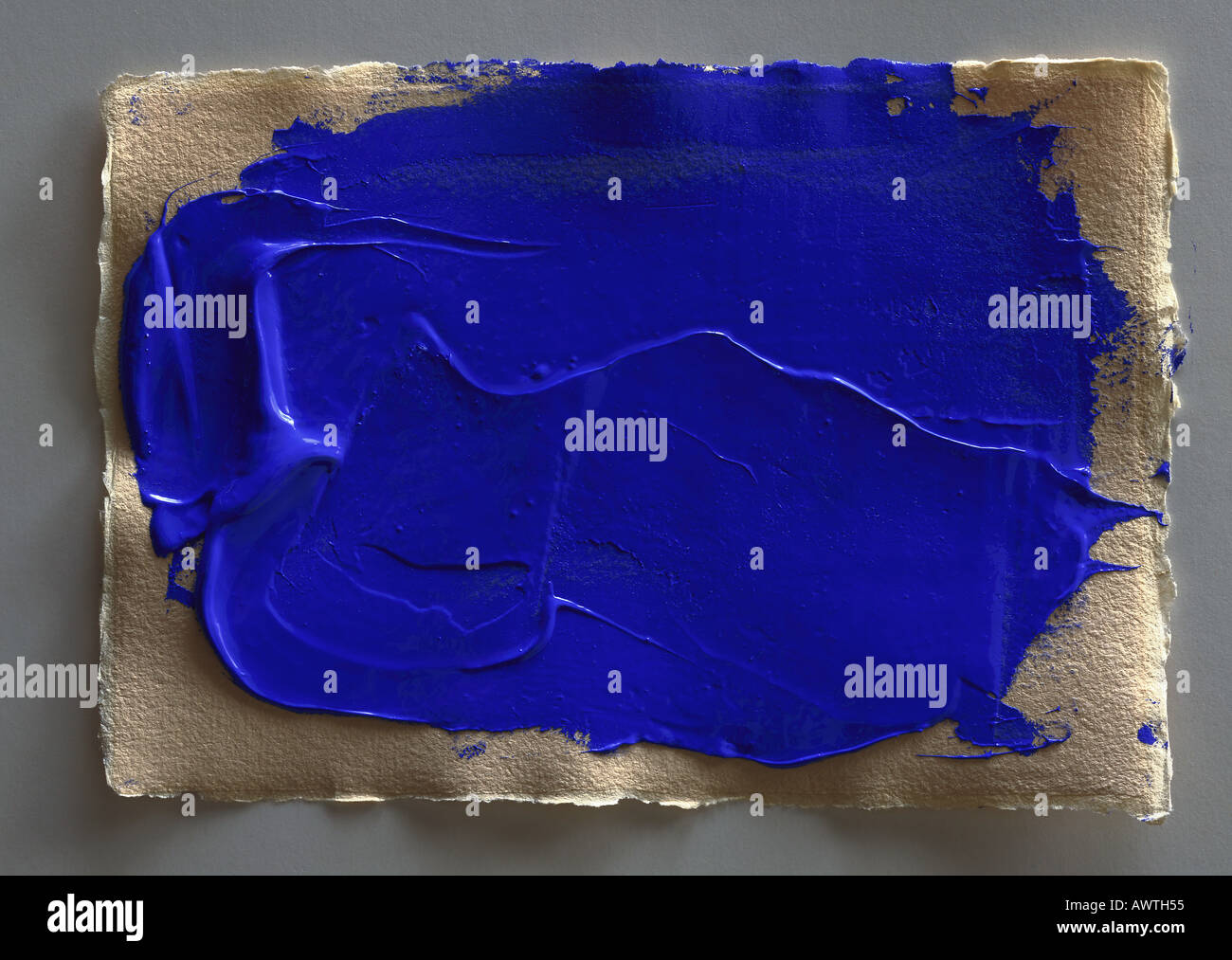 Blue paint on art paper Stock Photo - Alamy