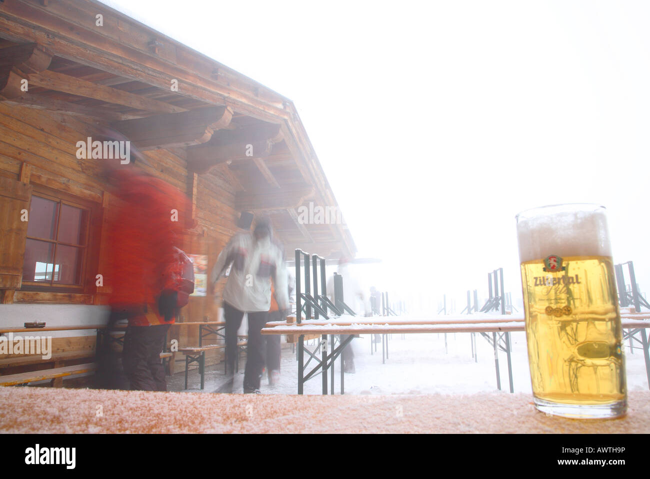 drinking drink beer outside Apres ski Wintersport in the mountains of ...