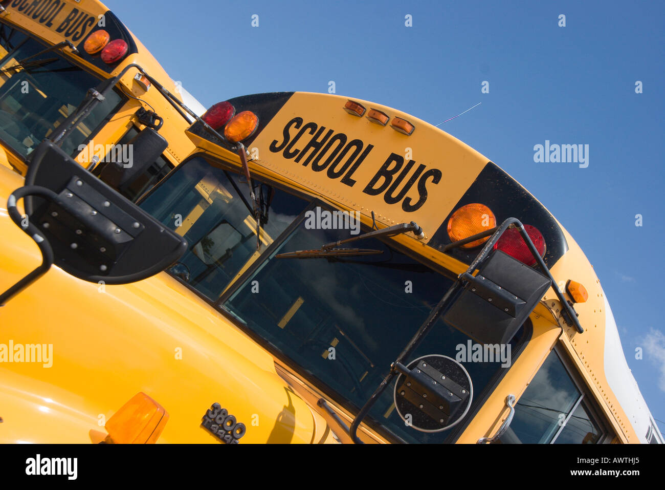 A Variety Of Different Types Of School Buses Fill The Lot Waiting To Be a-variety-of-different-types-of-school-buses-fill-the-lot-waiting-to-be