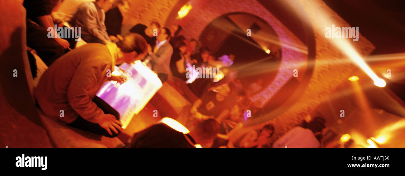 People sitting at tables in nightclub Stock Photo - Alamy