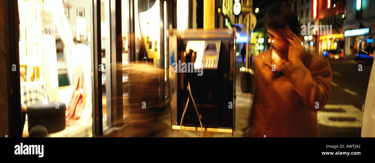 Urban street scene at night, blurred motion Stock Photo - Alamy
