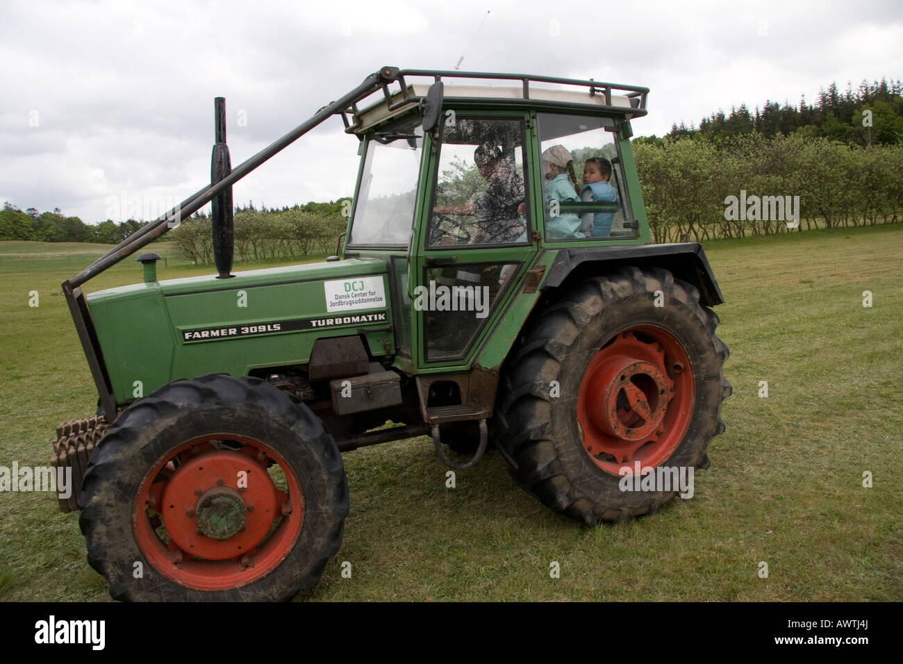 Children take a tractor driving trip Stock Photo - Alamy