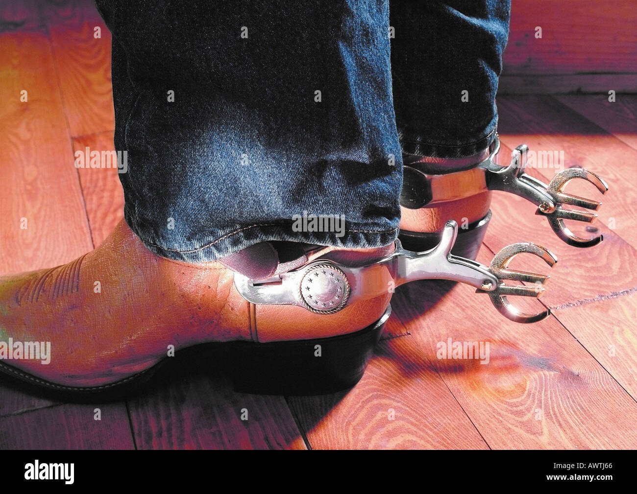 Euro sign boot spurs Stock Photo - Alamy