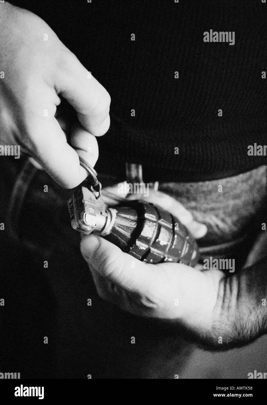Hand grenade in hand pin hi-res stock photography and images - Alamy