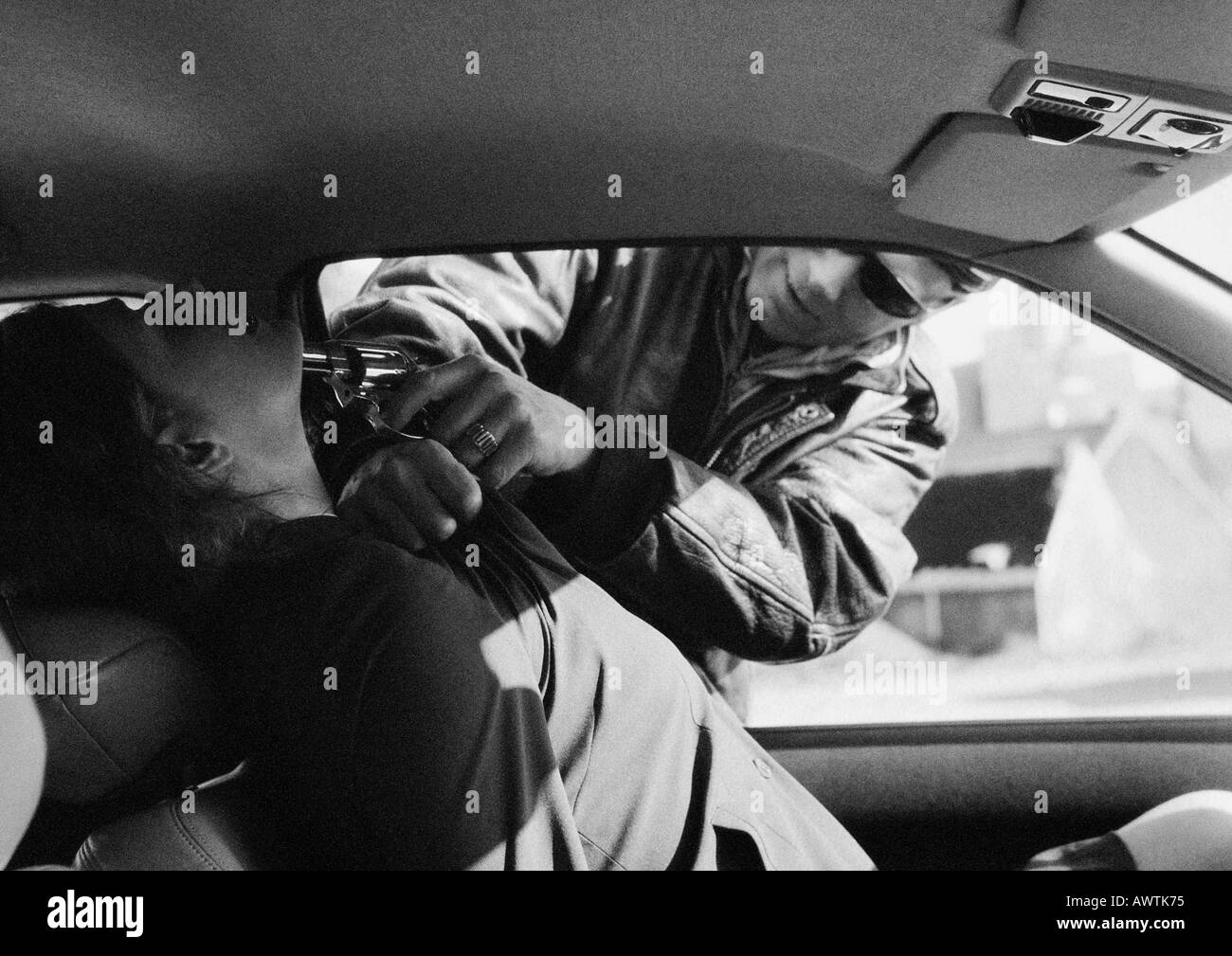 Man holding gun to woman's neck through car window, b&w Stock Photo - Alamy