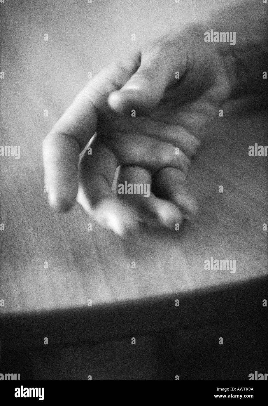 Hand on table, close-up, b&w Stock Photo - Alamy