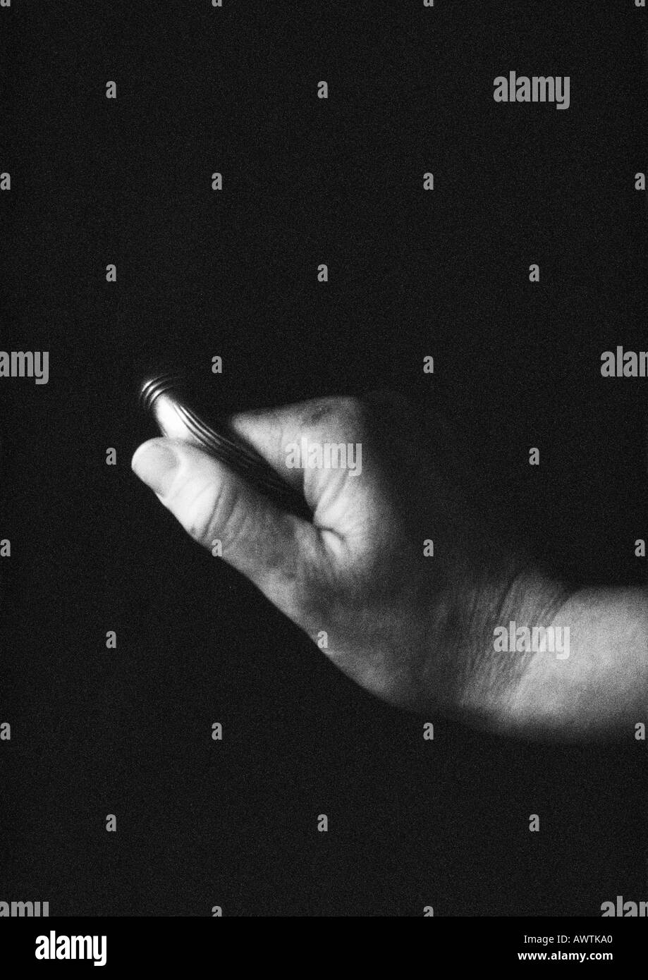 Hand holding handle, close-up, b&w Stock Photo - Alamy