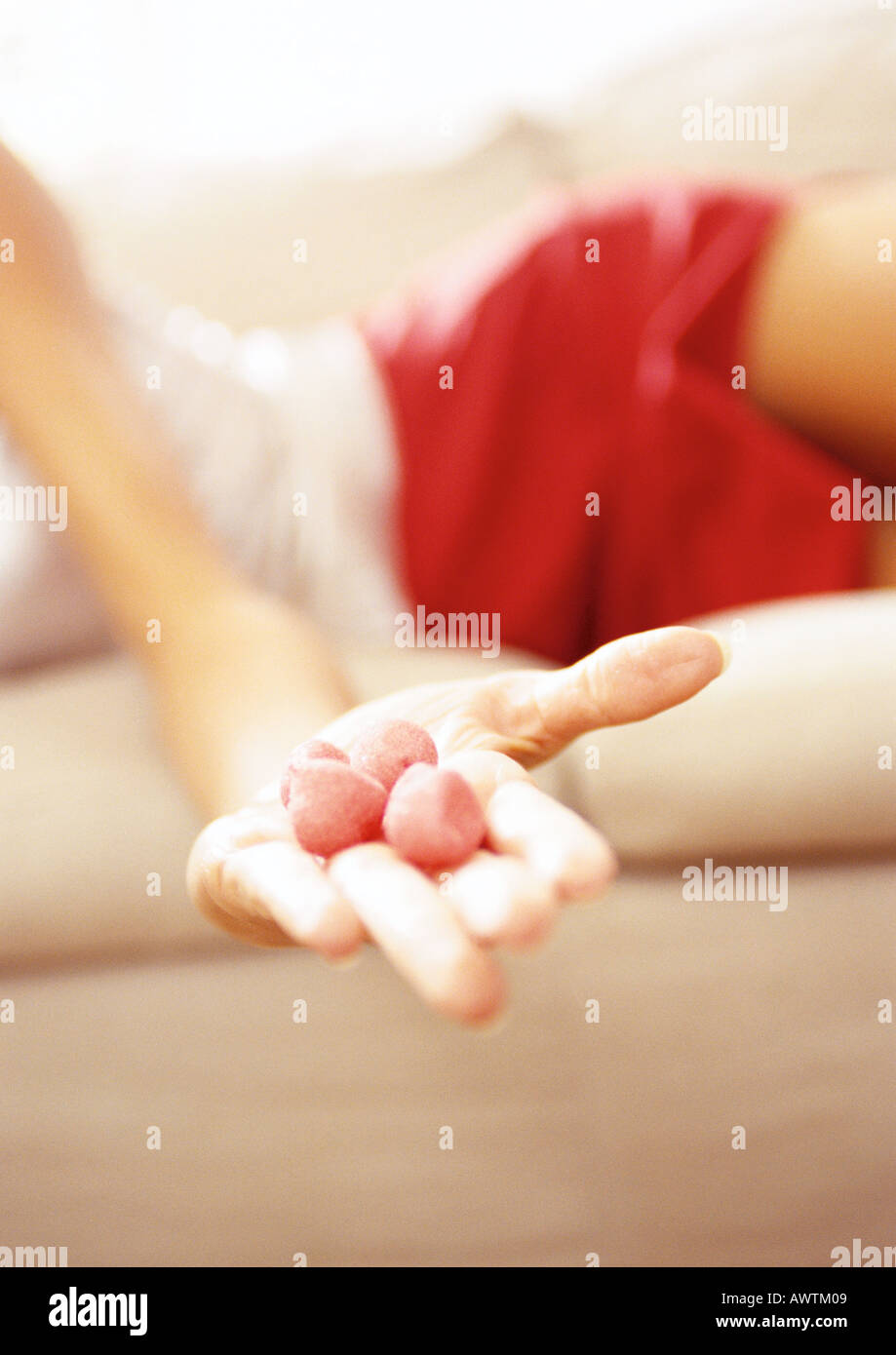 Hand offering candy hi-res stock photography and images - Alamy