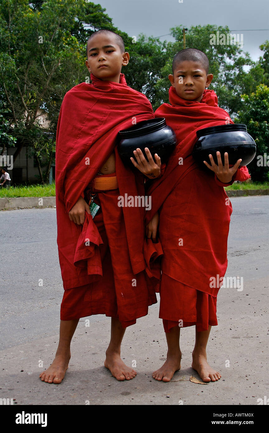 Young monks collecting food donations Stock Photo - Alamy