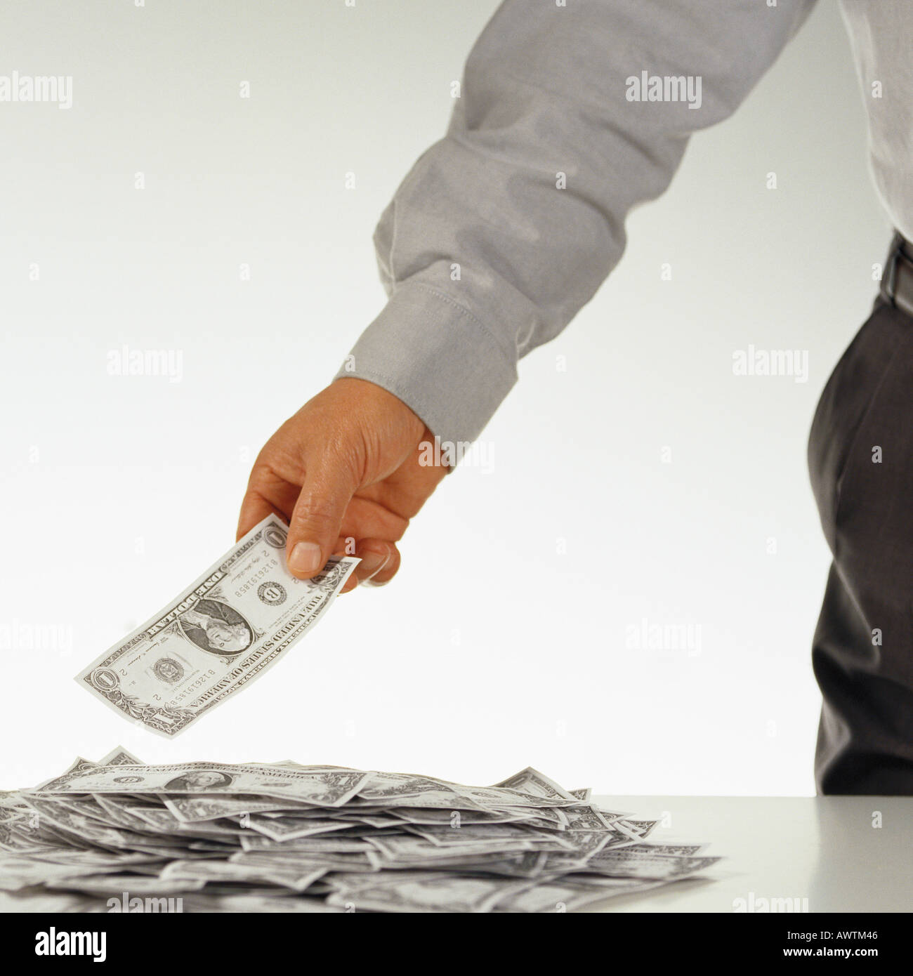 Man holds pile cash hand hi-res stock photography and images - Alamy