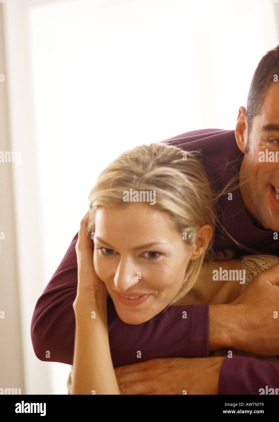 Woman embraces smiling man behind hi-res stock photography and images ...