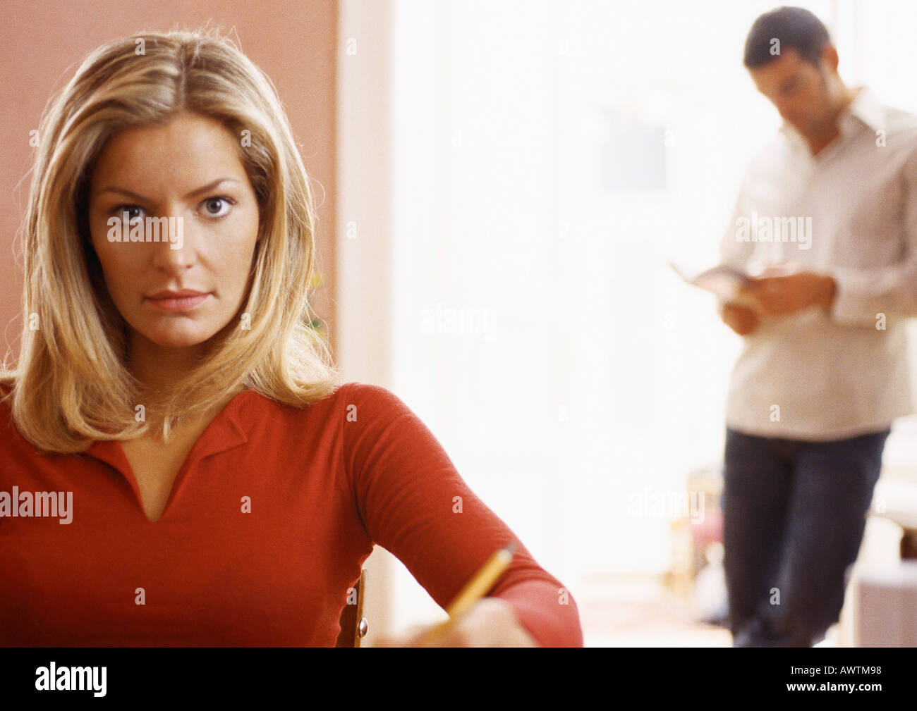 Stern woman looking at man hi-res stock photography and images - Alamy