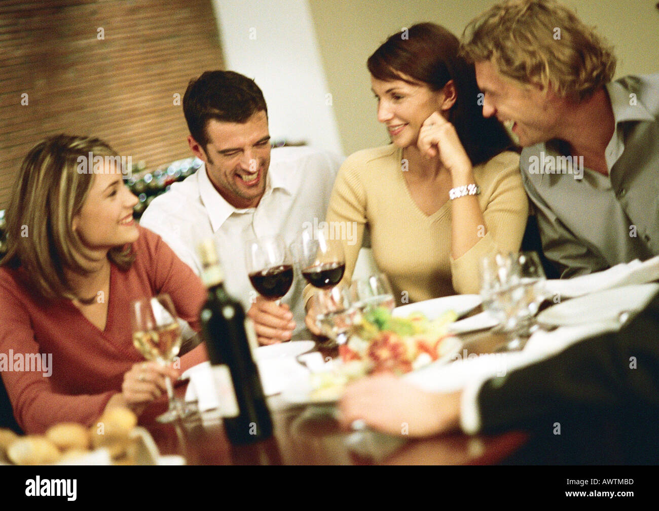 Adults dinner party sitting around hi-res stock photography and images ...