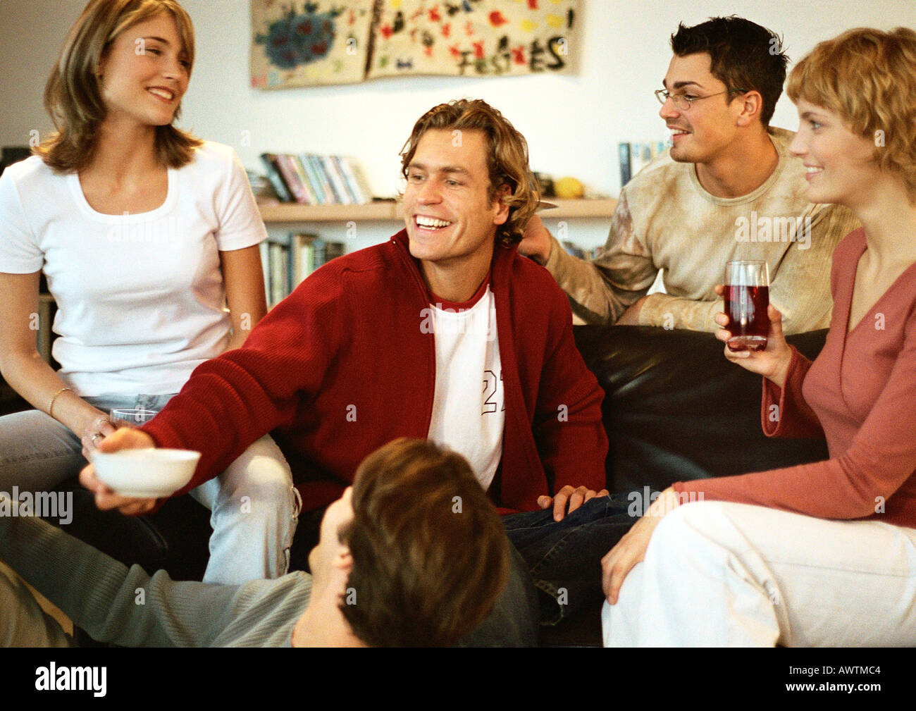 Group of friends talking indoor lounge hi-res stock photography and ...