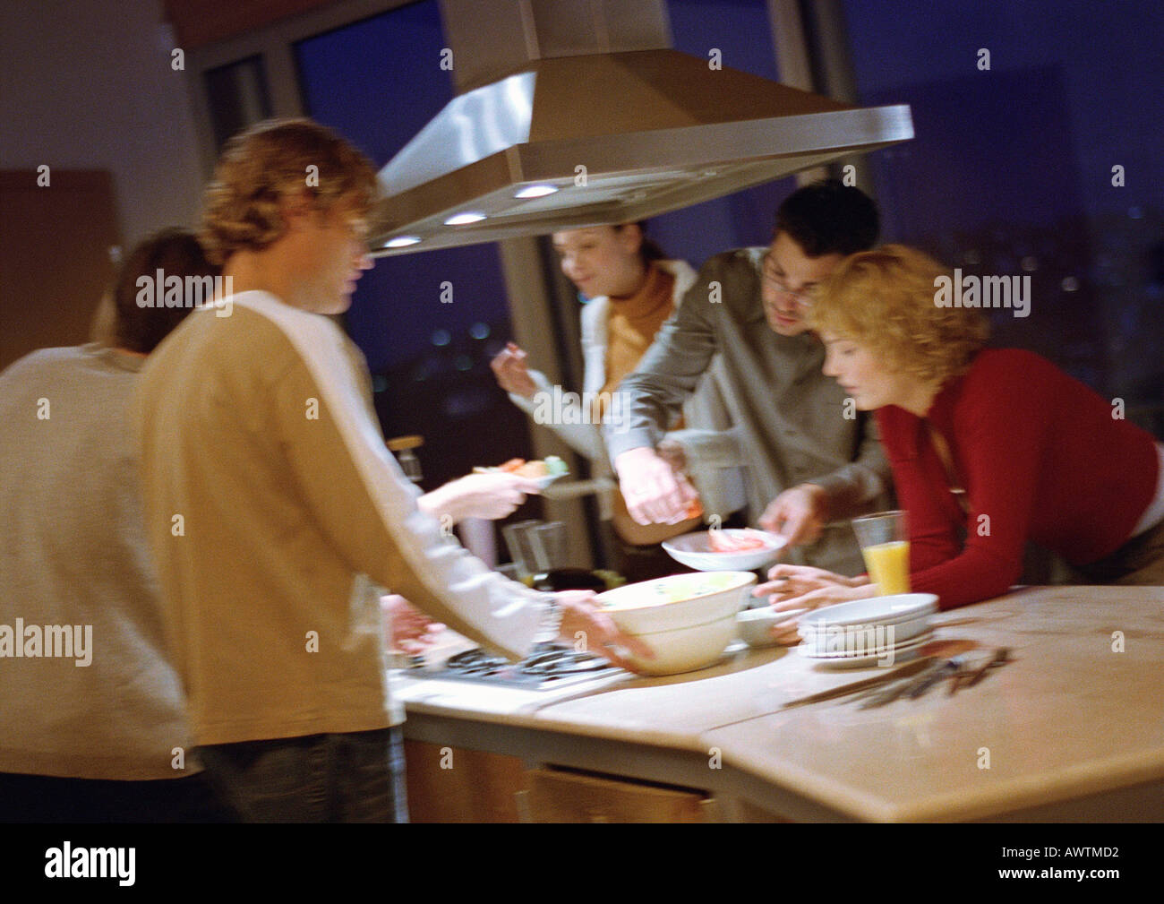 People cooking together in kitchen Stock Photo - Alamy