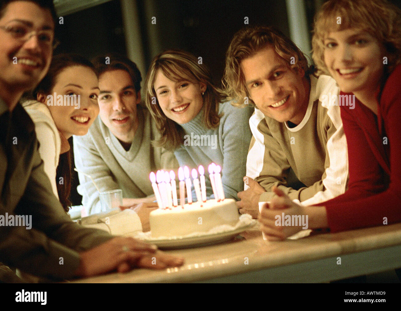 People sitting around birthday cake hi-res stock photography and images ...