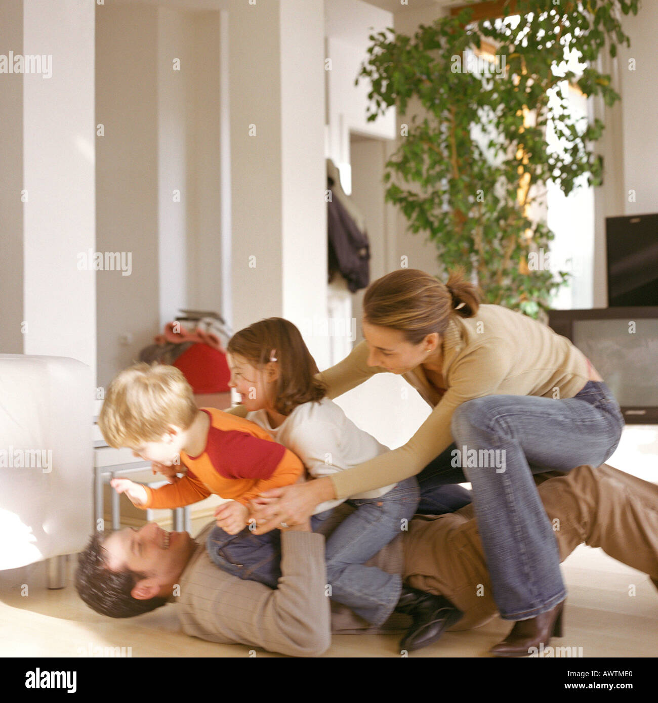 Family playing together Stock Photo - Alamy