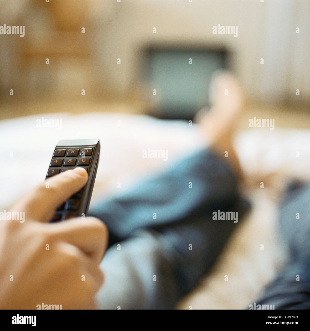 Person using remote control, cropped view Stock Photo - Alamy