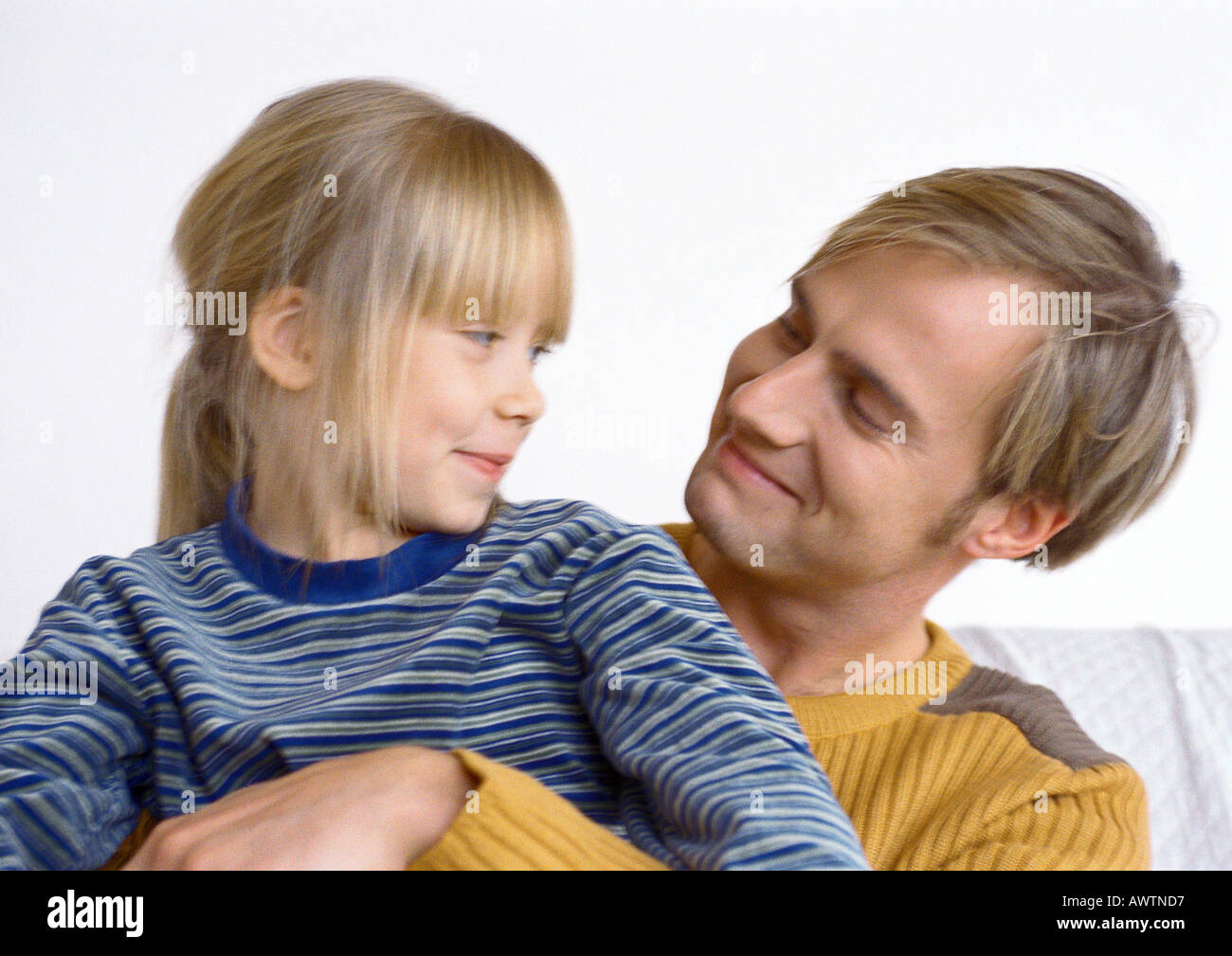 Father and daughter looking at one another Stock Photo - Alamy