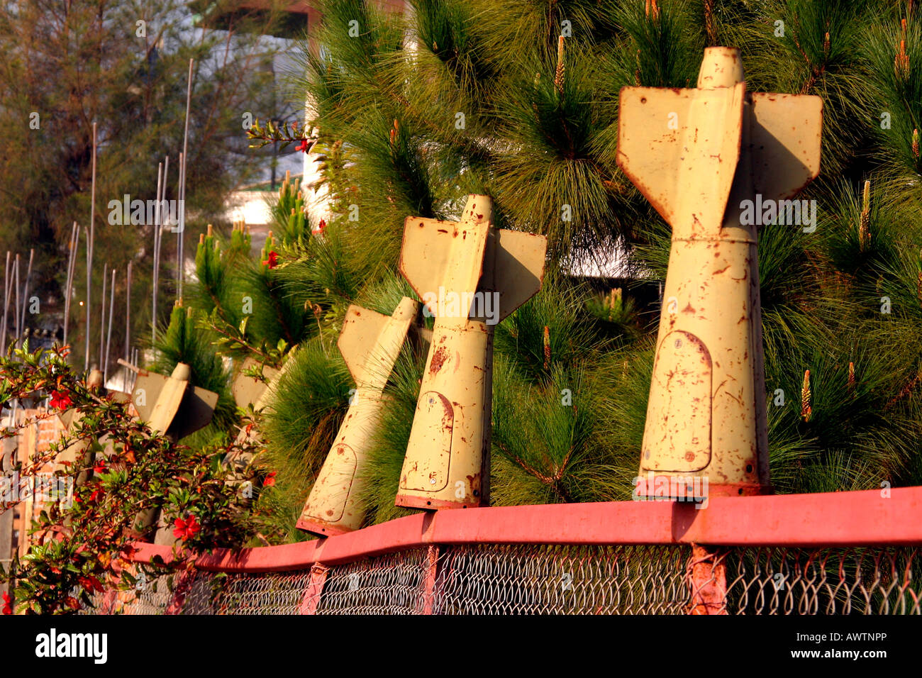 Laos Phonsavan Fence decorated with bomb tails Stock Photo - Alamy