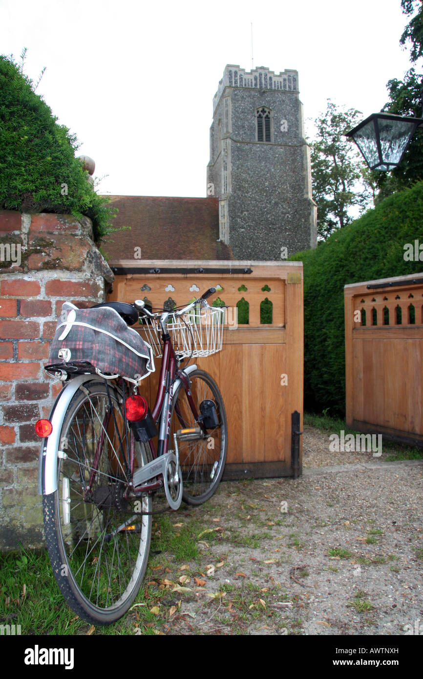 Ladies' bicycle at a country church gate Stock Photo - Alamy