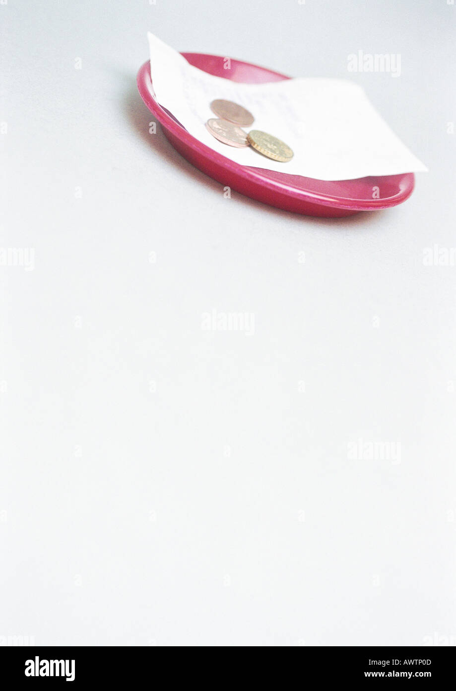 Euro coins with receipt in change tray Stock Photo - Alamy