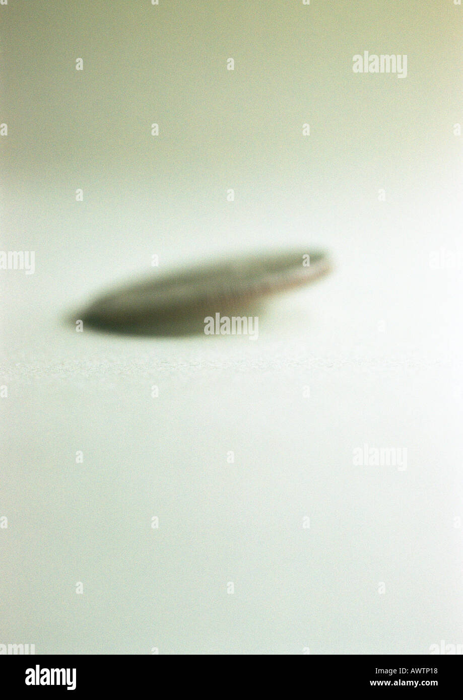 Coin, falling, blurred, close-up Stock Photo - Alamy