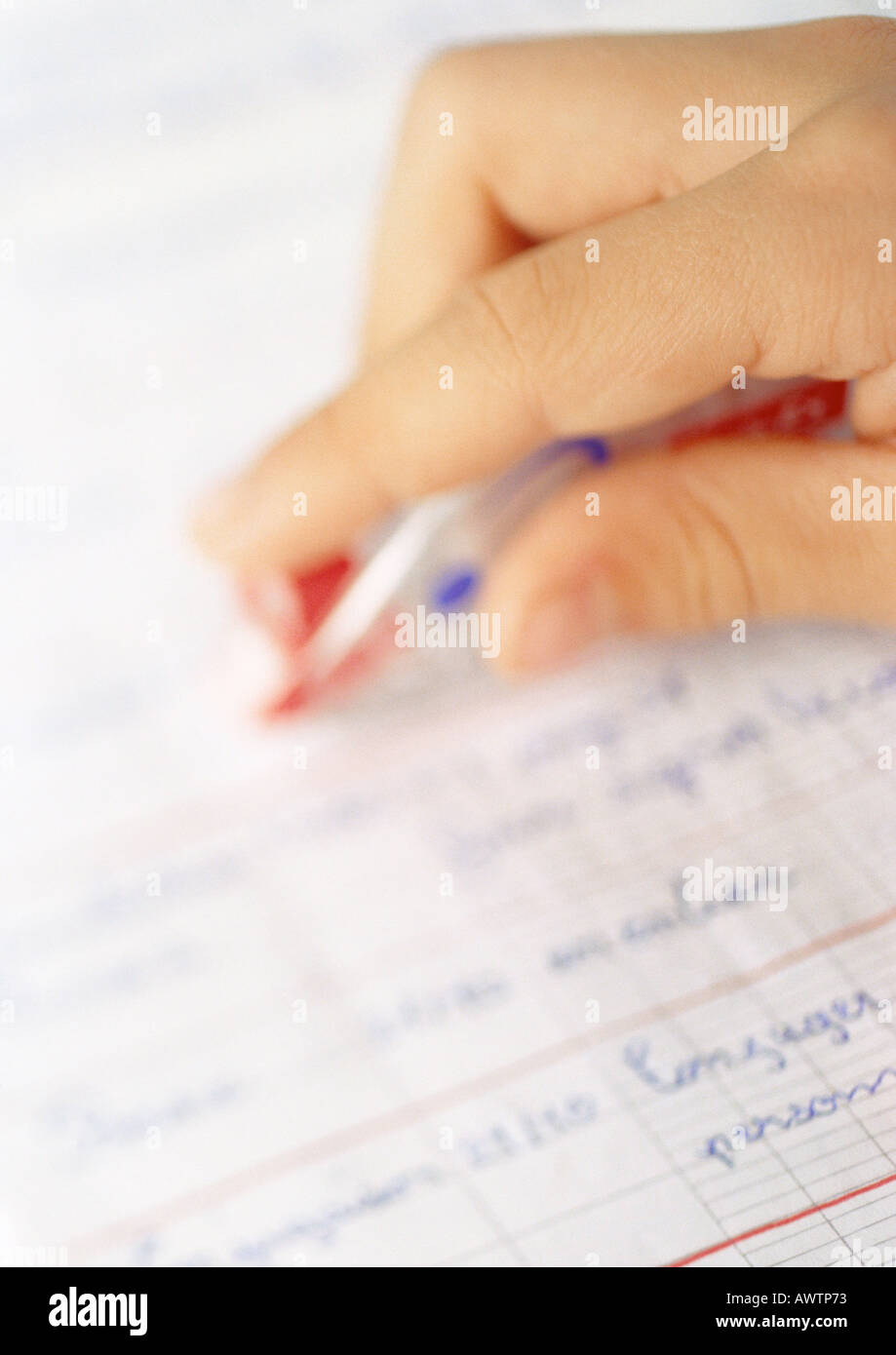 Hand holding correction tape over school notebook Stock Photo - Alamy