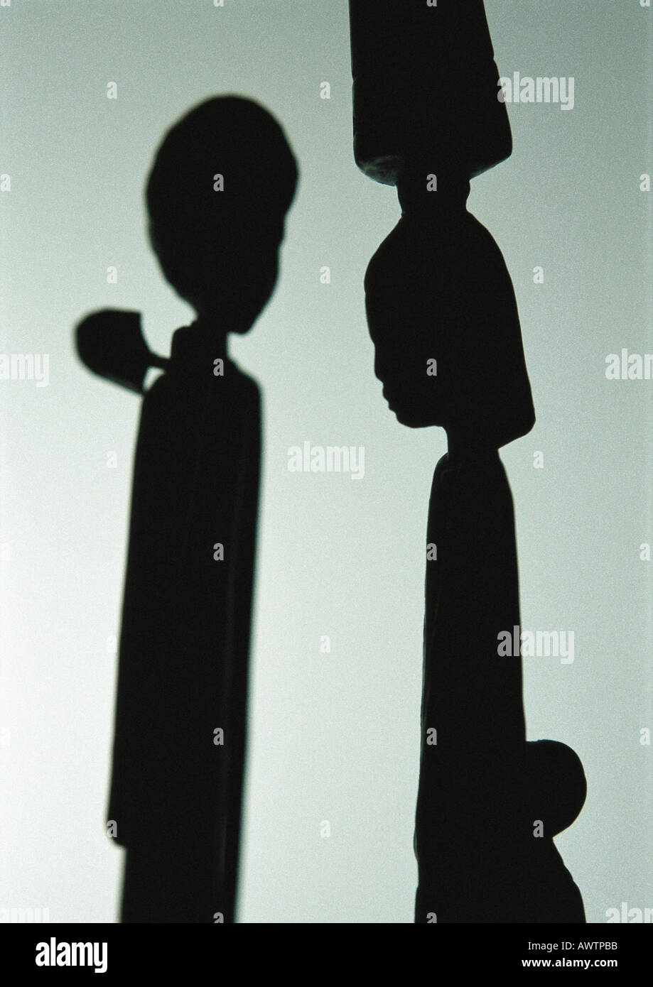 Traditional African sculptures in silhouette Stock Photo - Alamy
