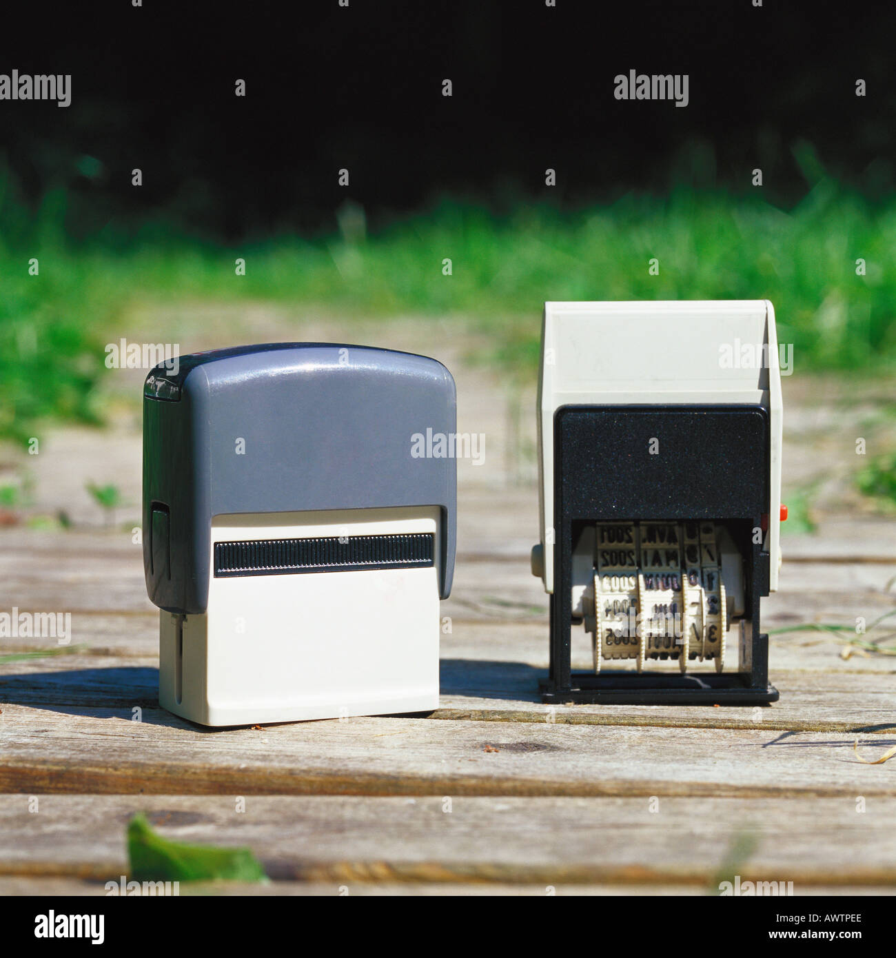 Date stampers on wooden walkway Stock Photo - Alamy