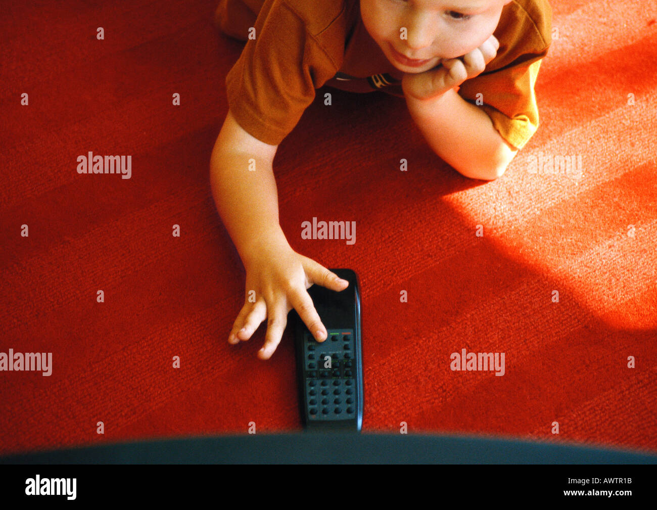 Boy using control change channels hi-res stock photography and images ...