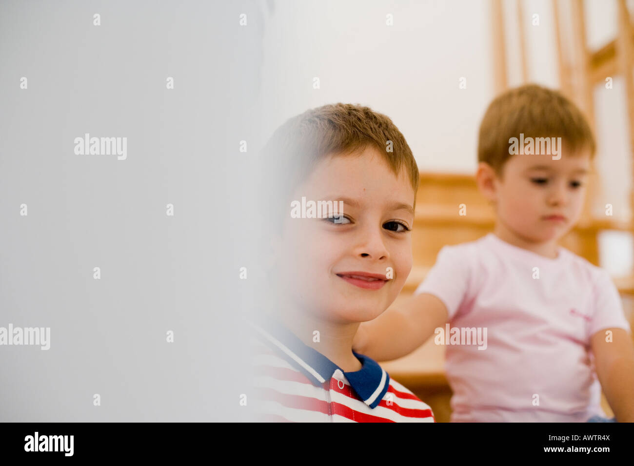 two children standing on wooden stairs Stock Photo - Alamy