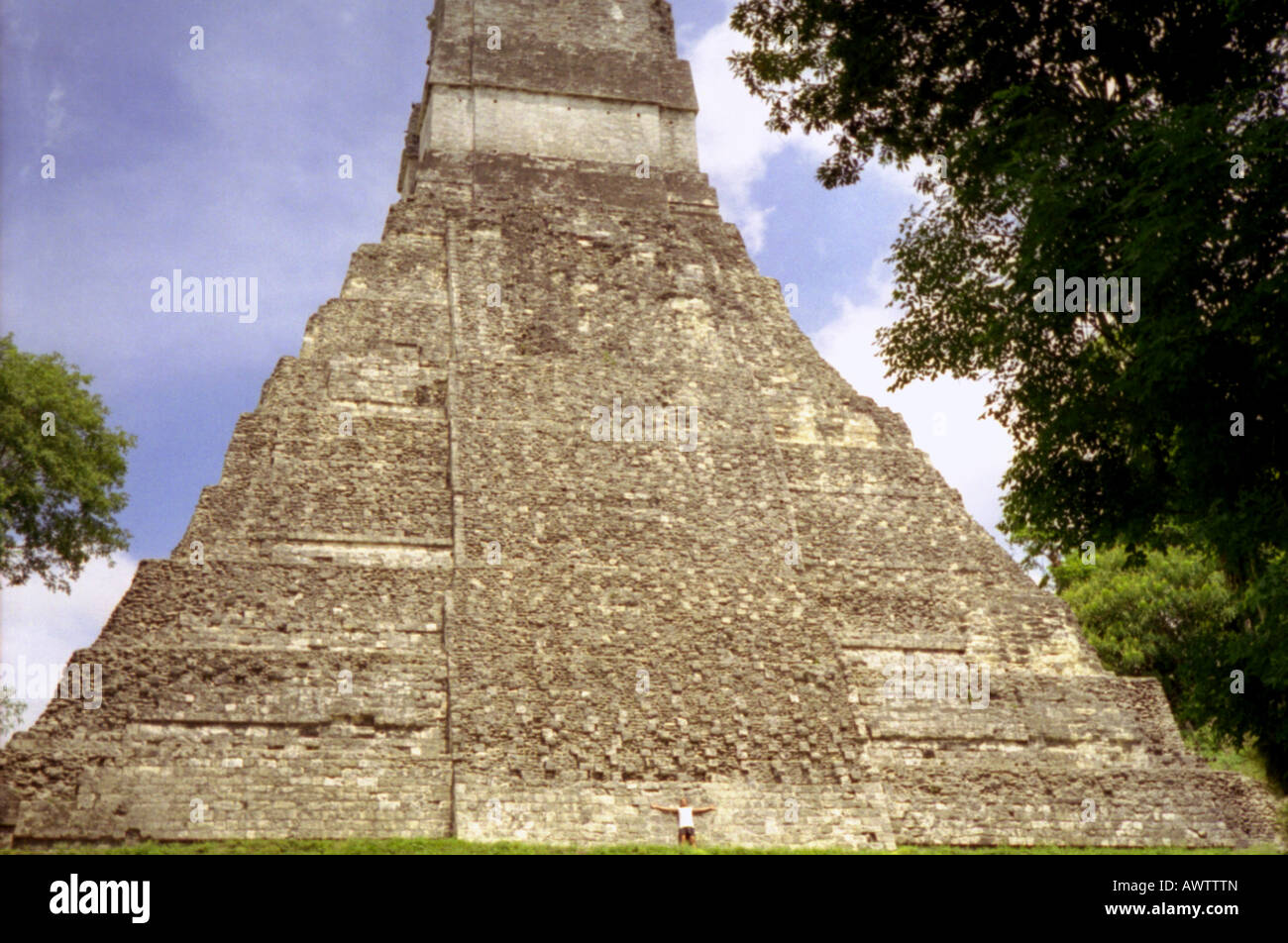 Panoramic view imposing Maya stone pyramid man standing Tikal Guatemala ...