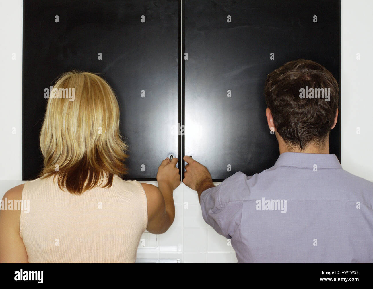 Reaching into cupboard hi-res stock photography and images - Alamy