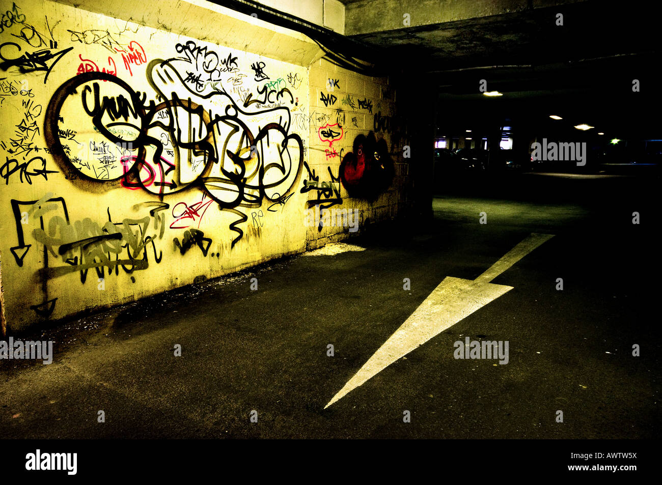 Graffiti - A dark intimidating underground garage with graffiti covered ...