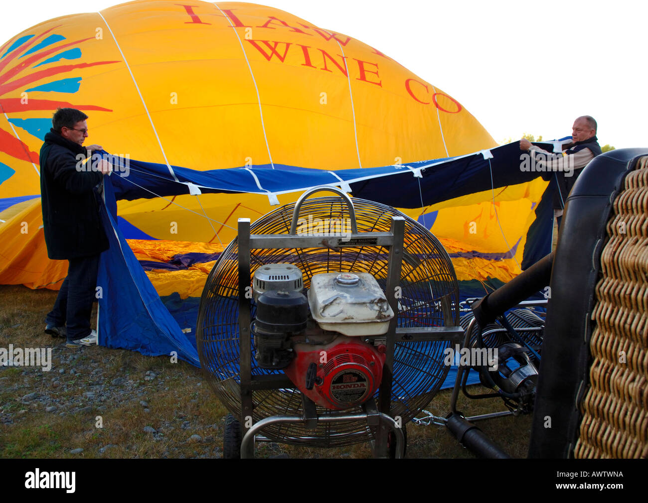Inflating a hot air balloon with petrol powered fan Stock Photo - Alamy