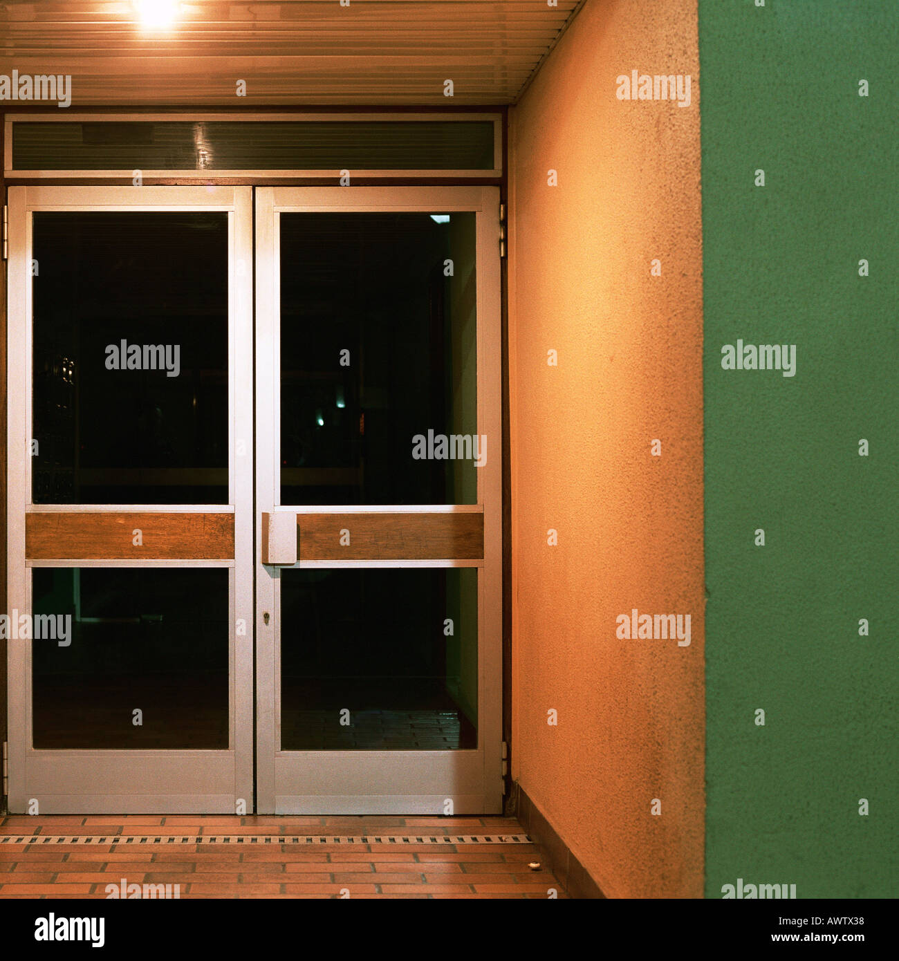 Closed doors at night Stock Photo - Alamy
