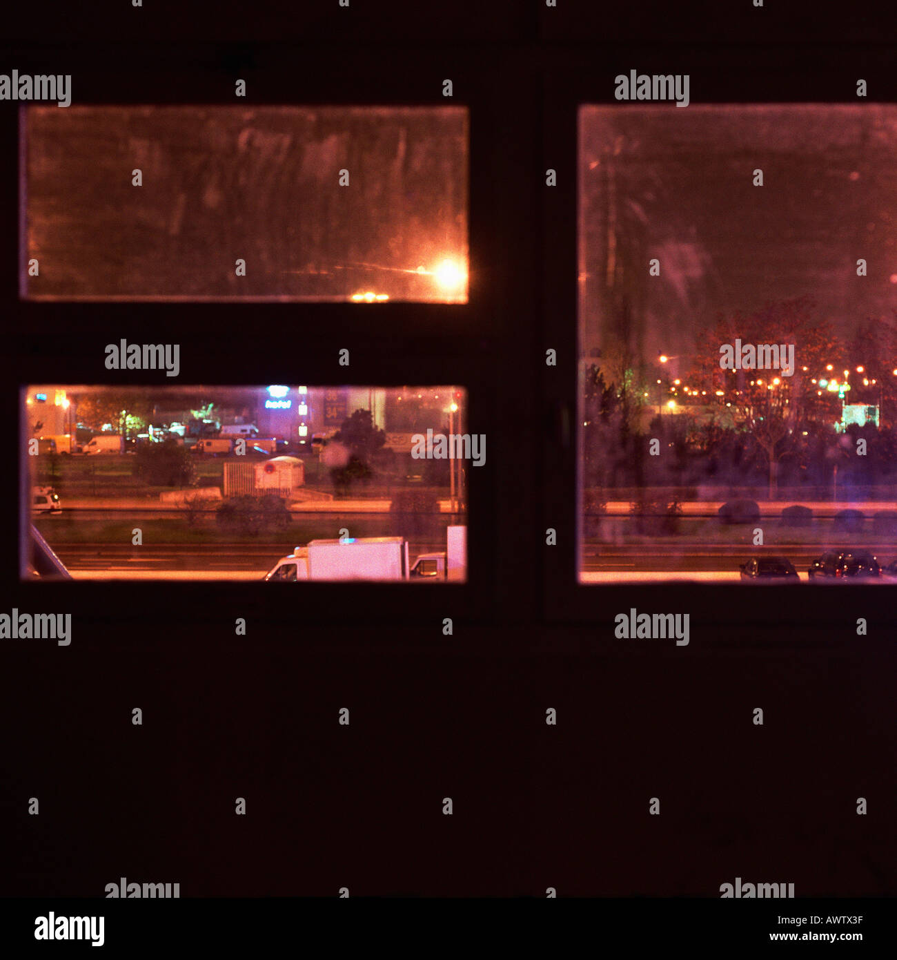 City street, seen through window at night, elevated view Stock Photo ...