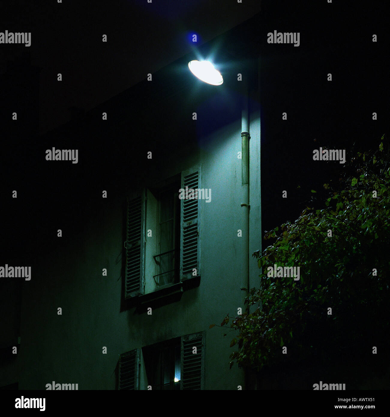 Security light on building, night Stock Photo - Alamy